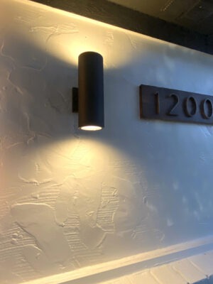 DIY wood cladding modern slat wall adds affordable warmth & curb appeal!